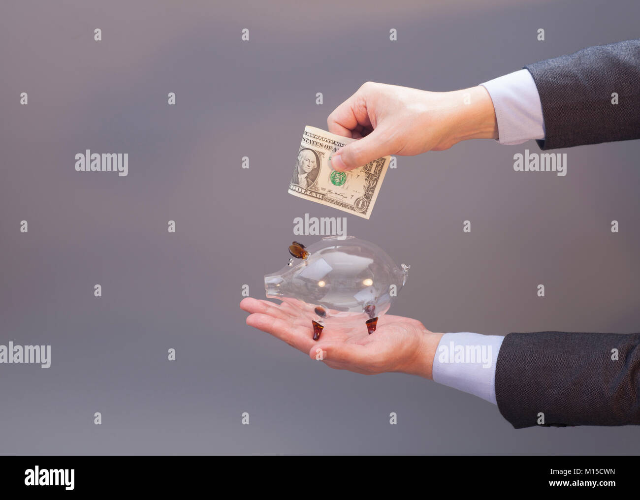 Businessman putting coin in glass hi-res stock photography and images ...