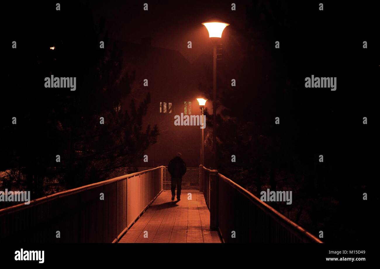 man on pedestrian bridge Stock Photo - Alamy