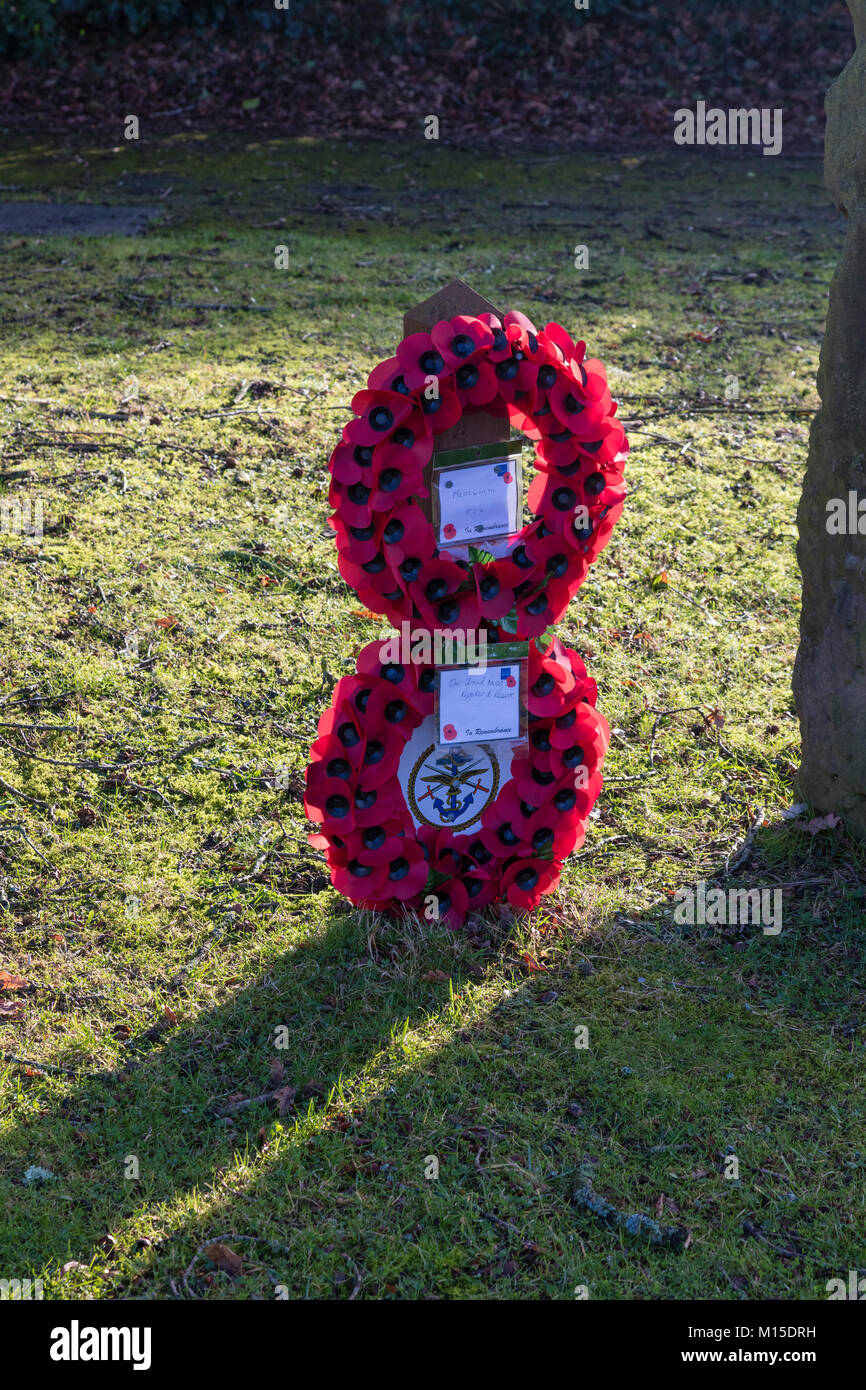 Two poppy wreaths at St Lawrence Church, Mereworth, Kent, Backlit by ...
