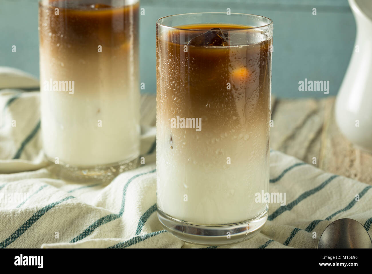 Refreshing Homemade Layered Iced Coffee with Milk Stock Photo - Alamy