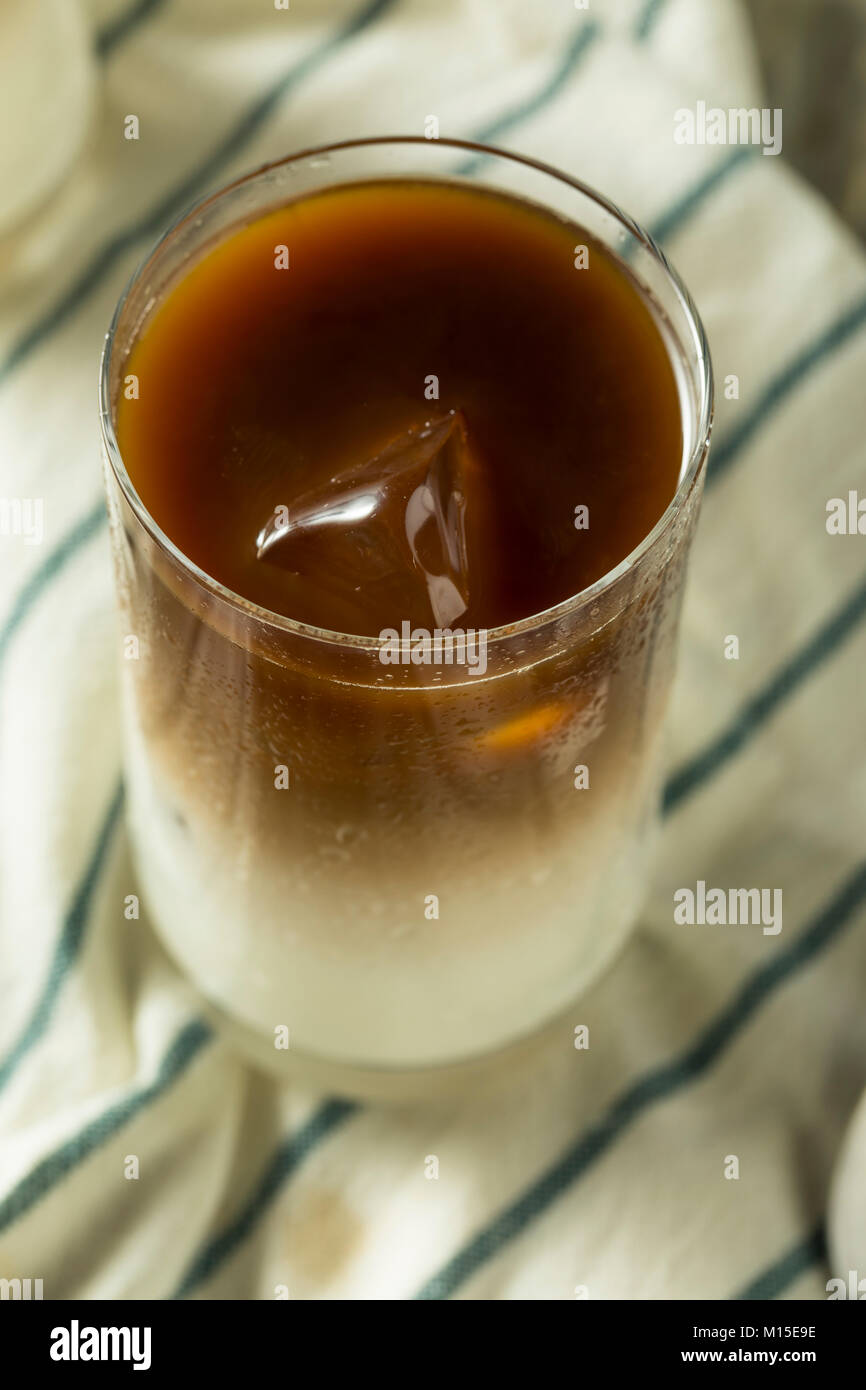 Refreshing Homemade Layered Iced Coffee with Milk Stock Photo - Alamy