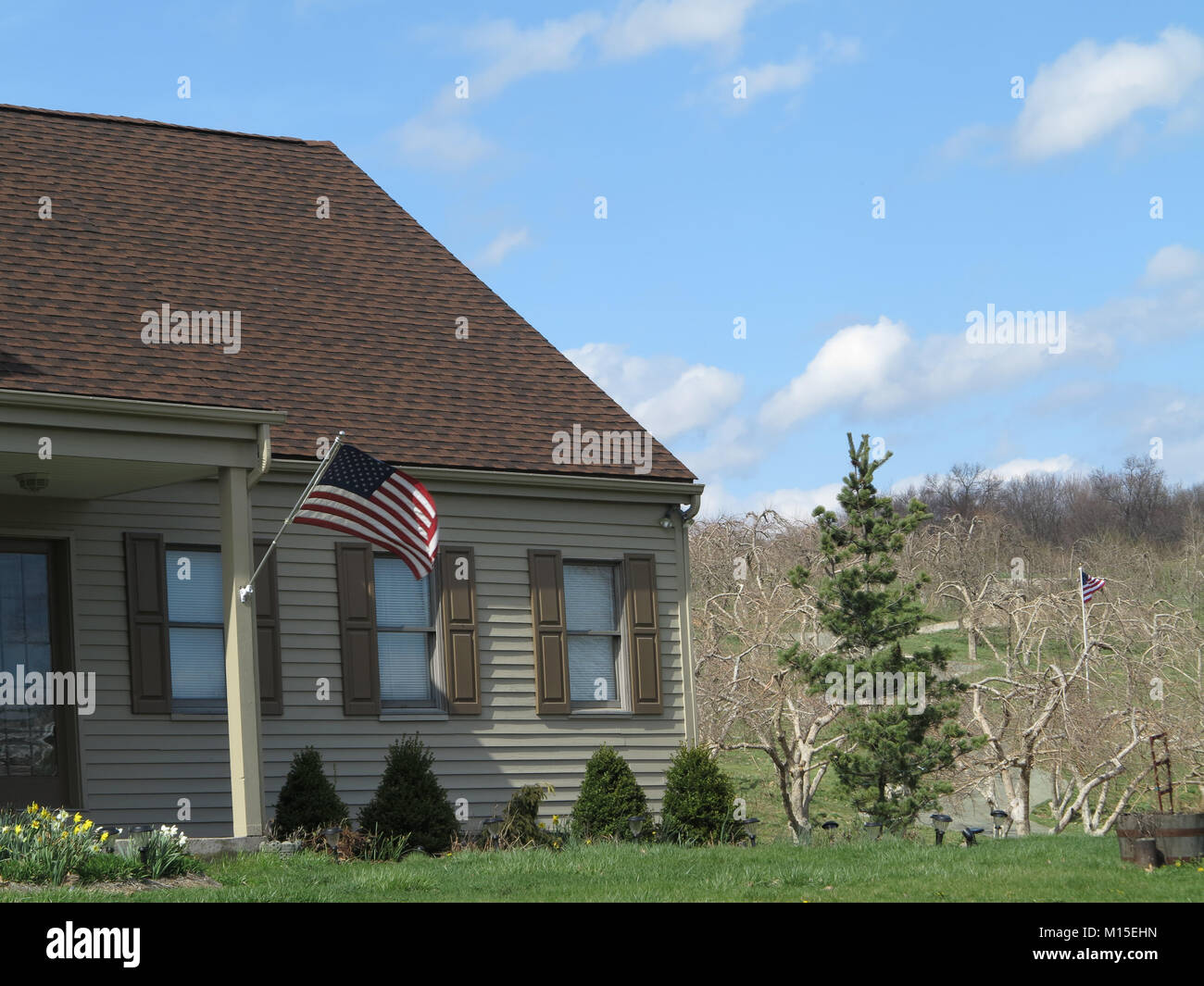 White colonial home american flag hi-res stock photography and images ...