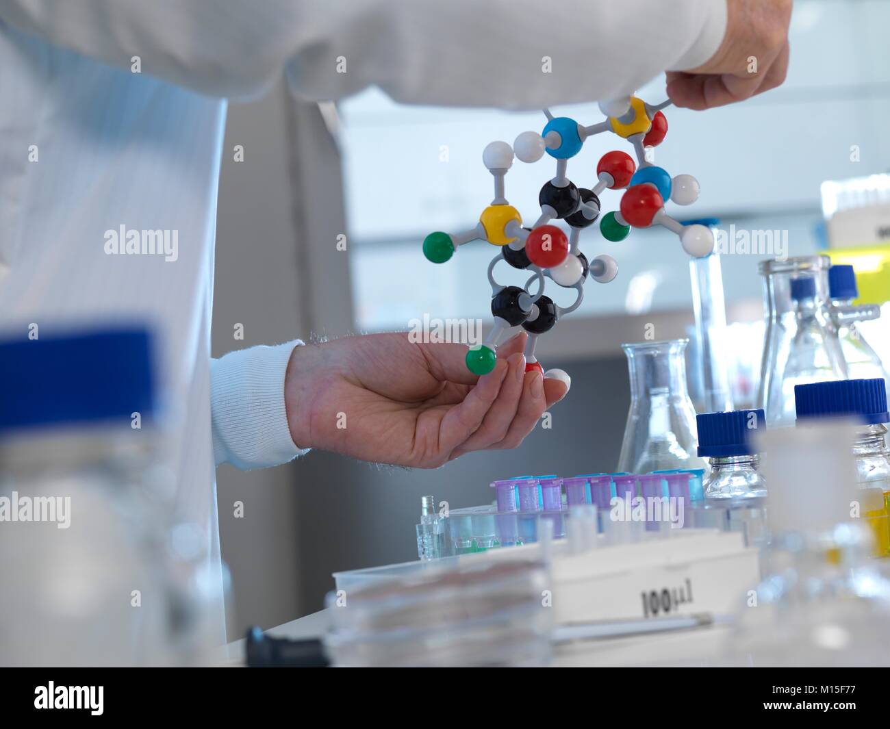 MODEL RELEASED. Chemistry research. Researcher designing a chemical ...