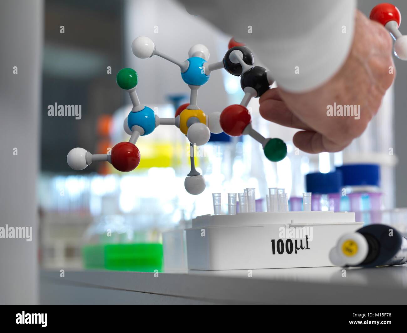 MODEL RELEASED. Chemistry research. Researcher designing a chemical ...