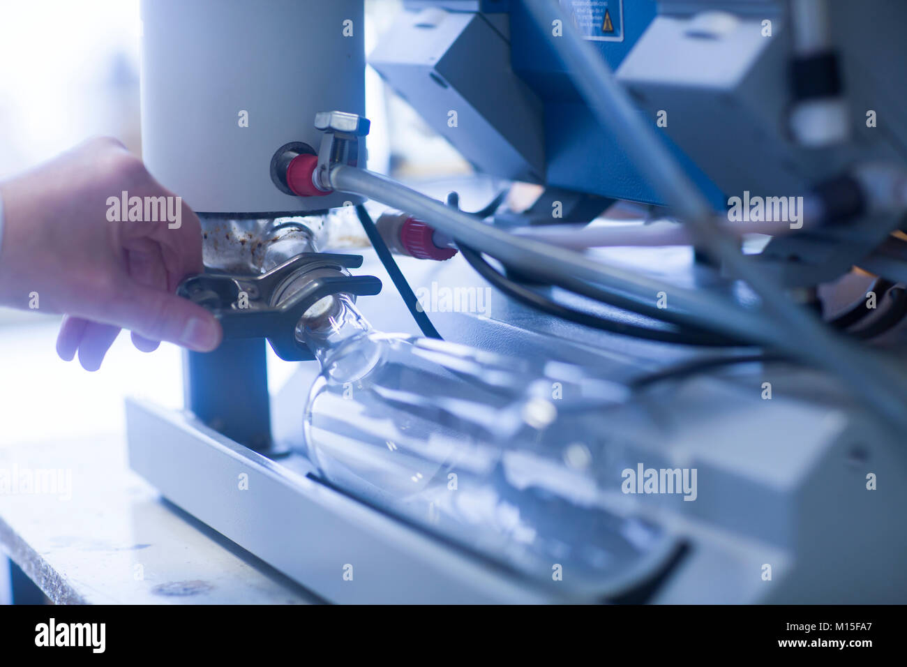 Chemist setting up a vacuum pump in a pharmaceutical laboratory Stock ...