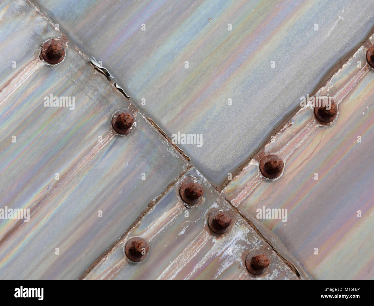 Bolted on Iridescent Metal Slabs in a Line Stock Photo - Alamy