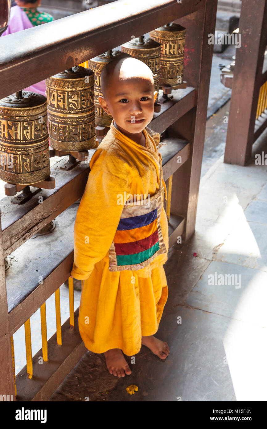 Young Napalese Hinduboy at pray wheel at Holy Temple in Patan ...