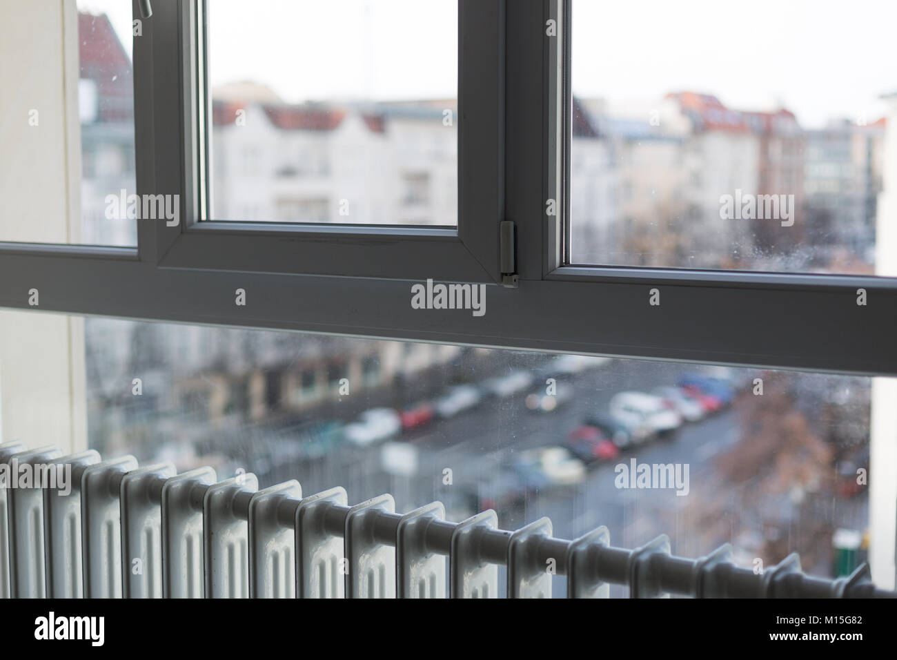 Heating radiator under window Stock Photo - Alamy