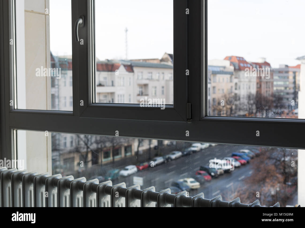 Heating radiator under window Stock Photo - Alamy