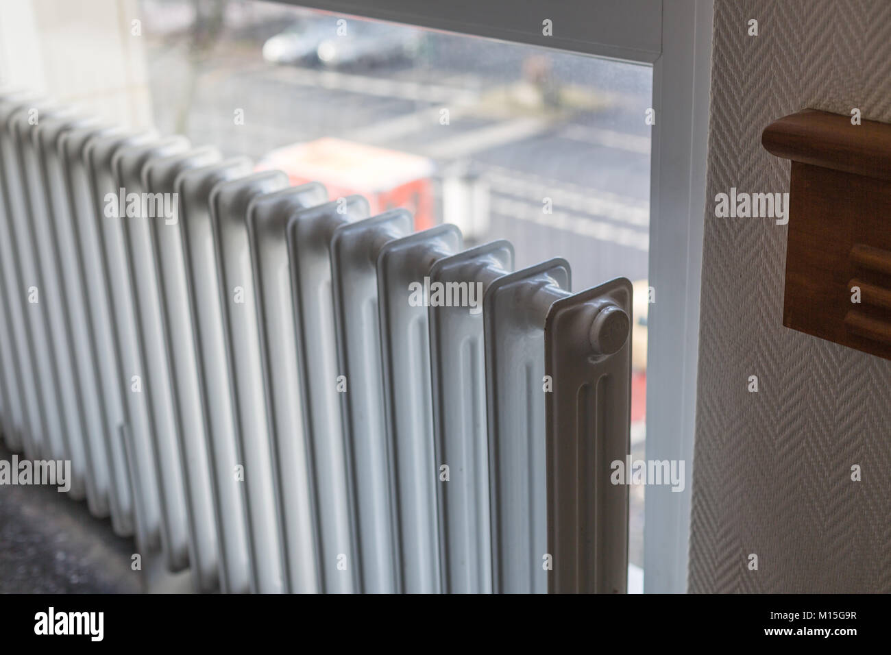 Heating radiator in front of window Stock Photo - Alamy