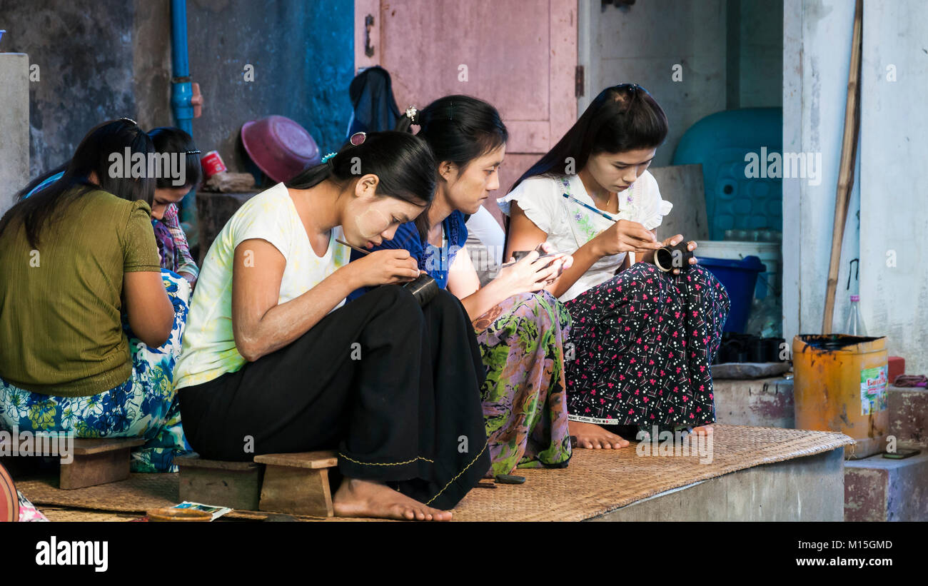 YANGON, MYANMAR - NOVEMBER, 2016: Manual workers in laquer factory. The ...