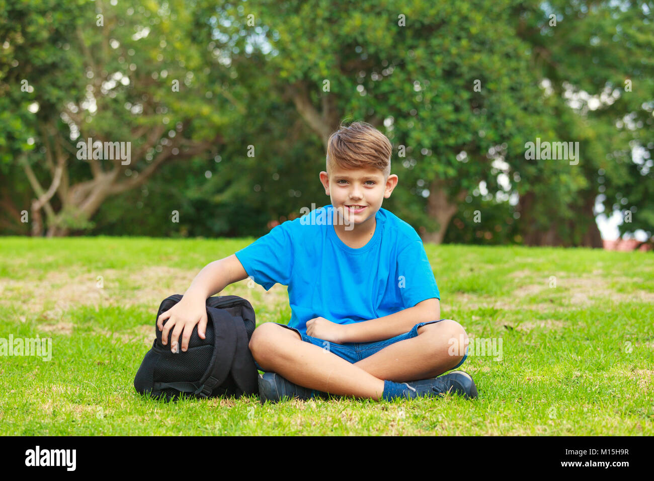 School Boy with backpack at the park Stock Photo - Alamy