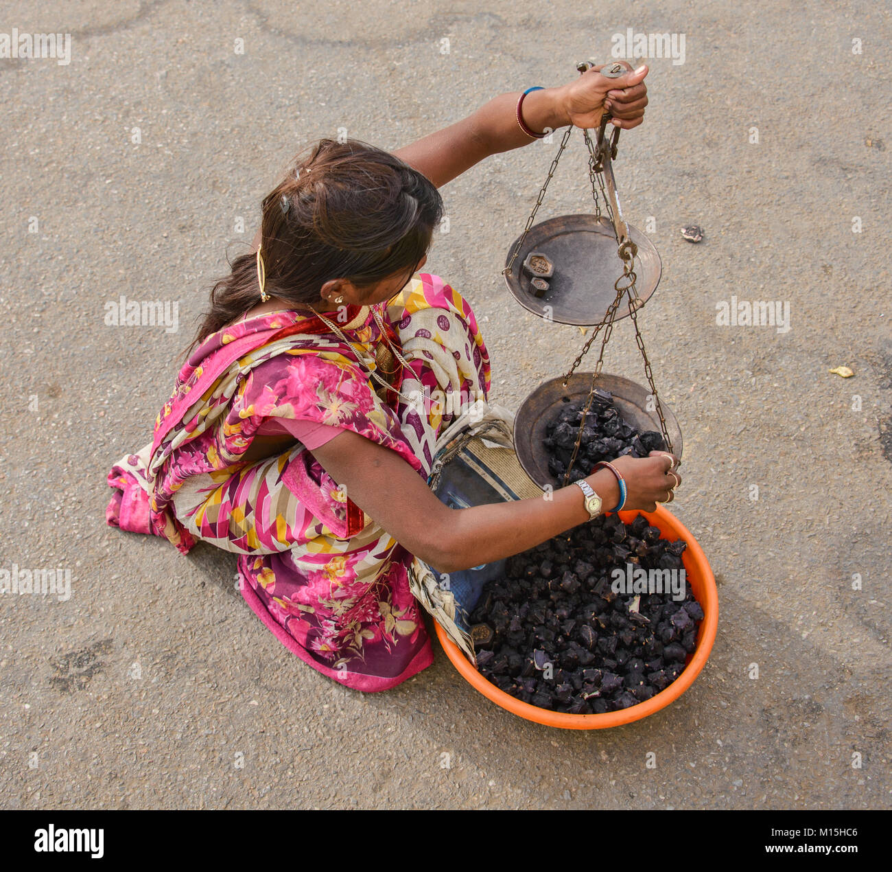 Indian woman selling Water Chesnut in the street of Rajasthan, India ...