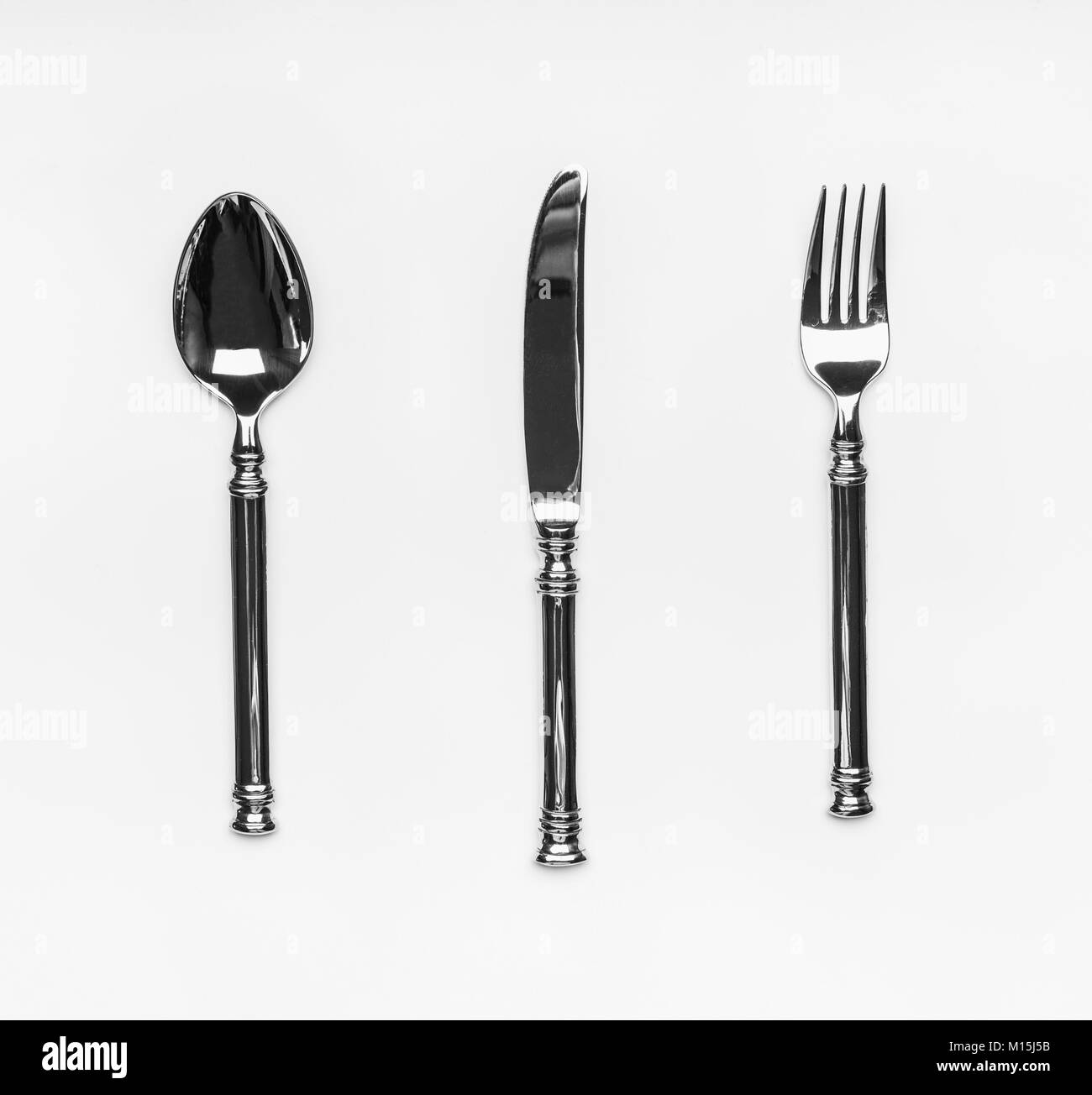 Table silverware cutlery setting with fork,knife and spoon on white ...