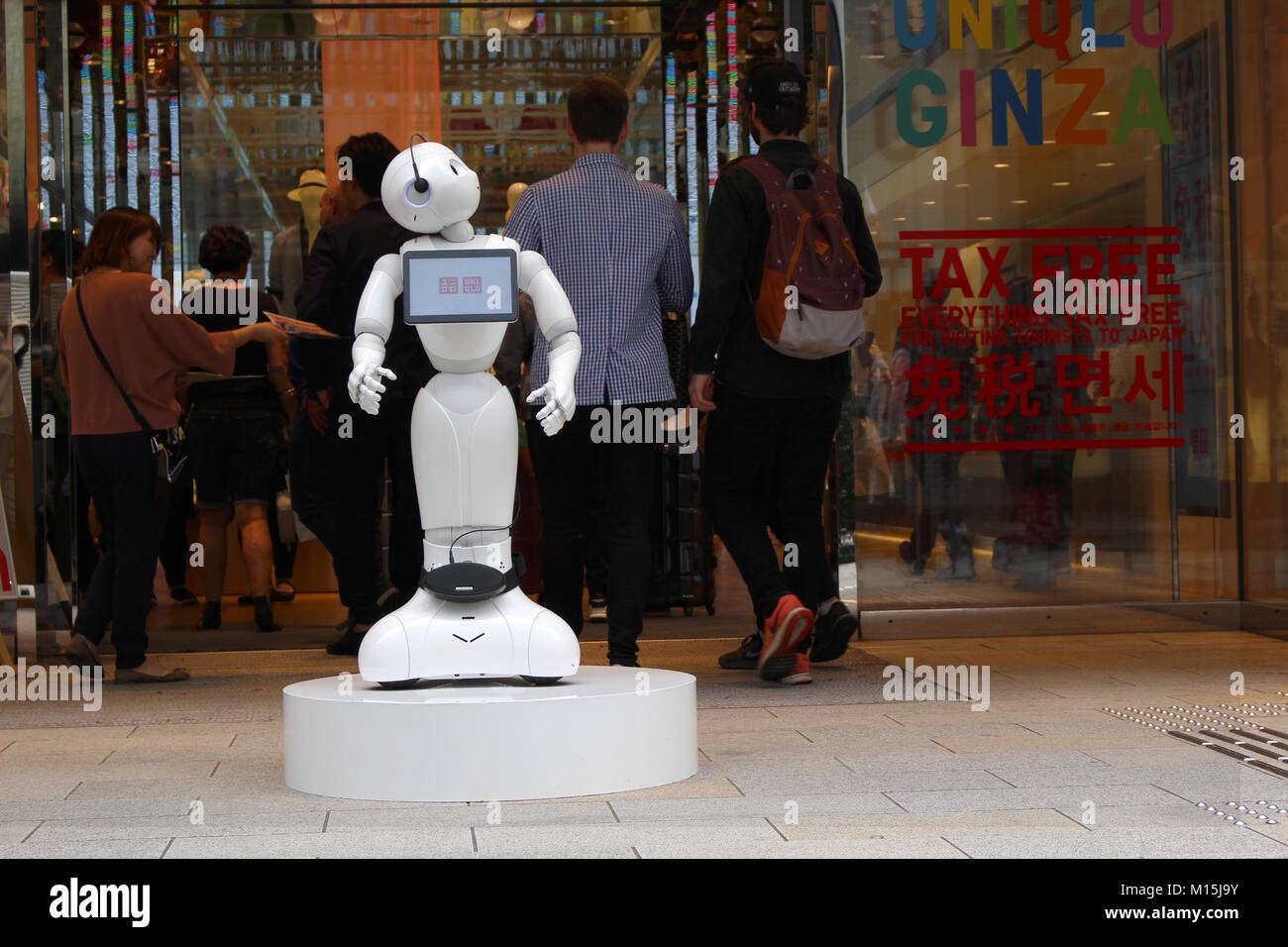 A Softbank Pepper robot outside Uniqlo's flagship store in Tokyo's ...