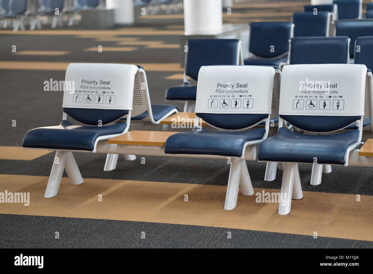 Empty seats at gate Priority Seating in airport Stock Photo - Alamy