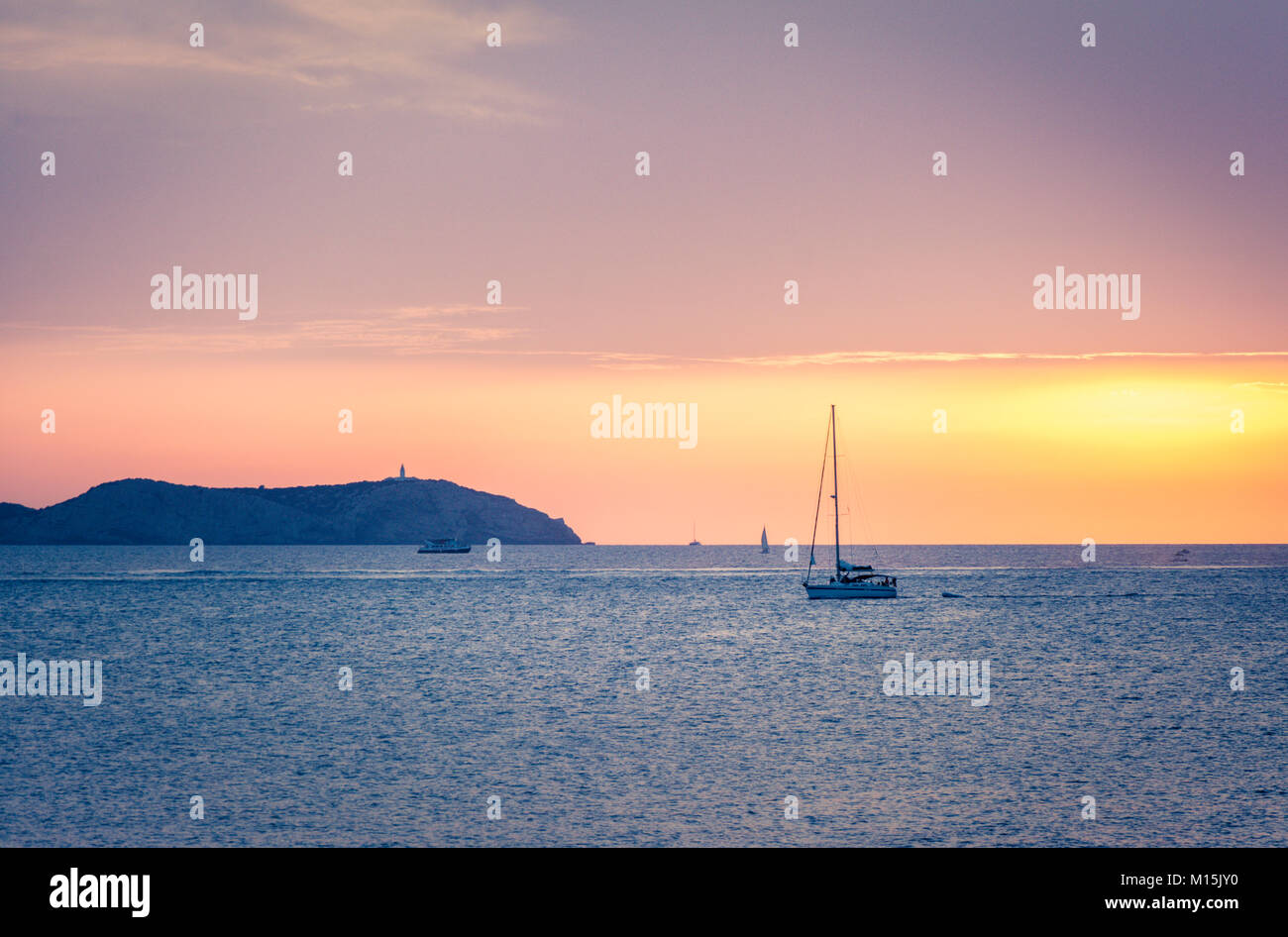 Balearic sea sunset sailing ship hi-res stock photography and images ...
