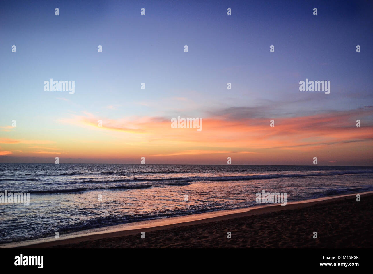 Beautiful sunset over sea on tropical island Stock Photo - Alamy