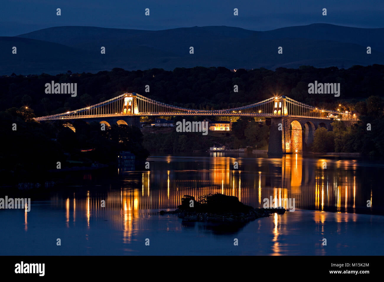 Thomas Telford suspension bridge across the Menai Straits at night ...