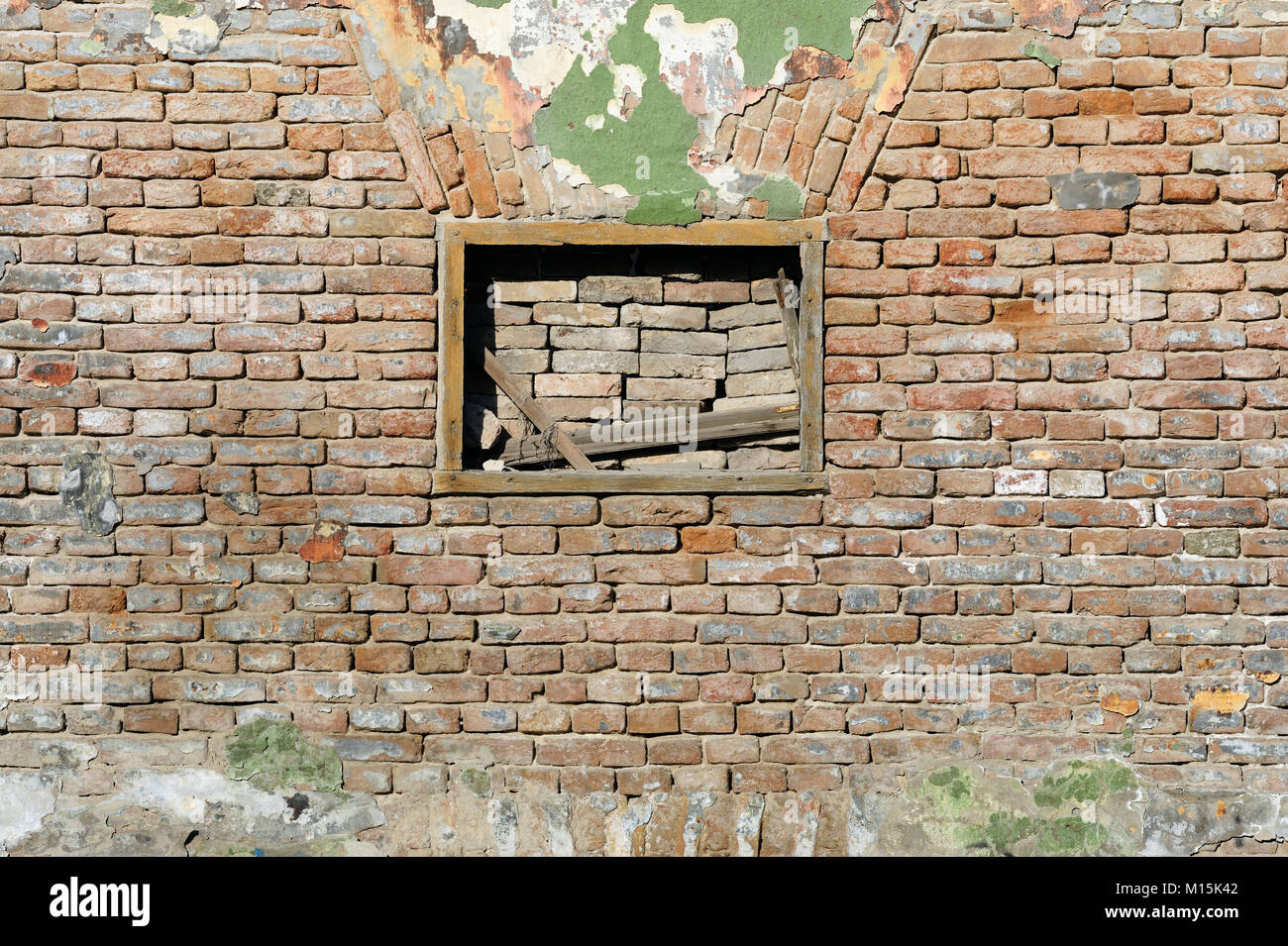 Abandoned house with a brick wall without windows Stock Photo - Alamy