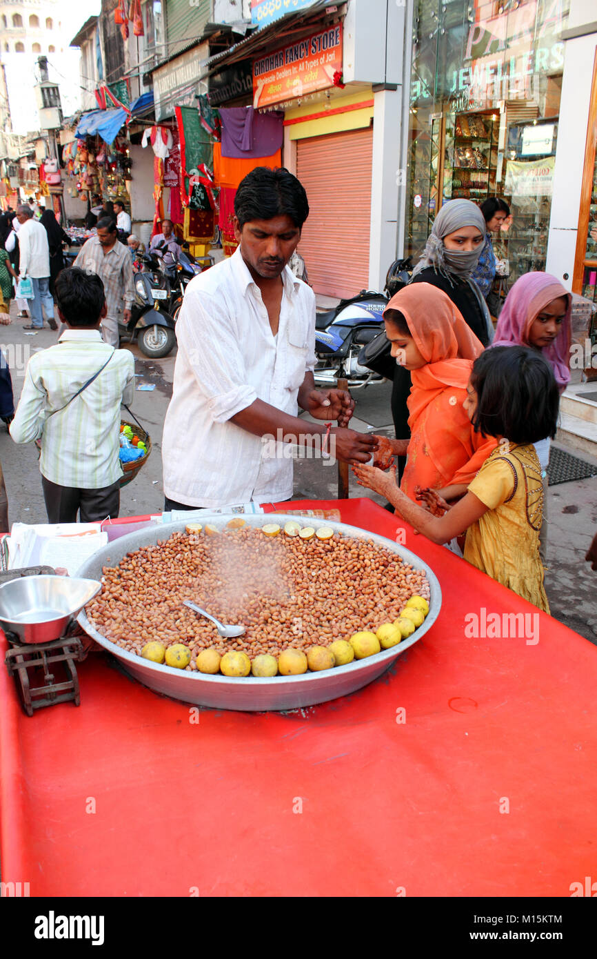 Street vendor selling peanuts to children near Charminar Hyderabad ...