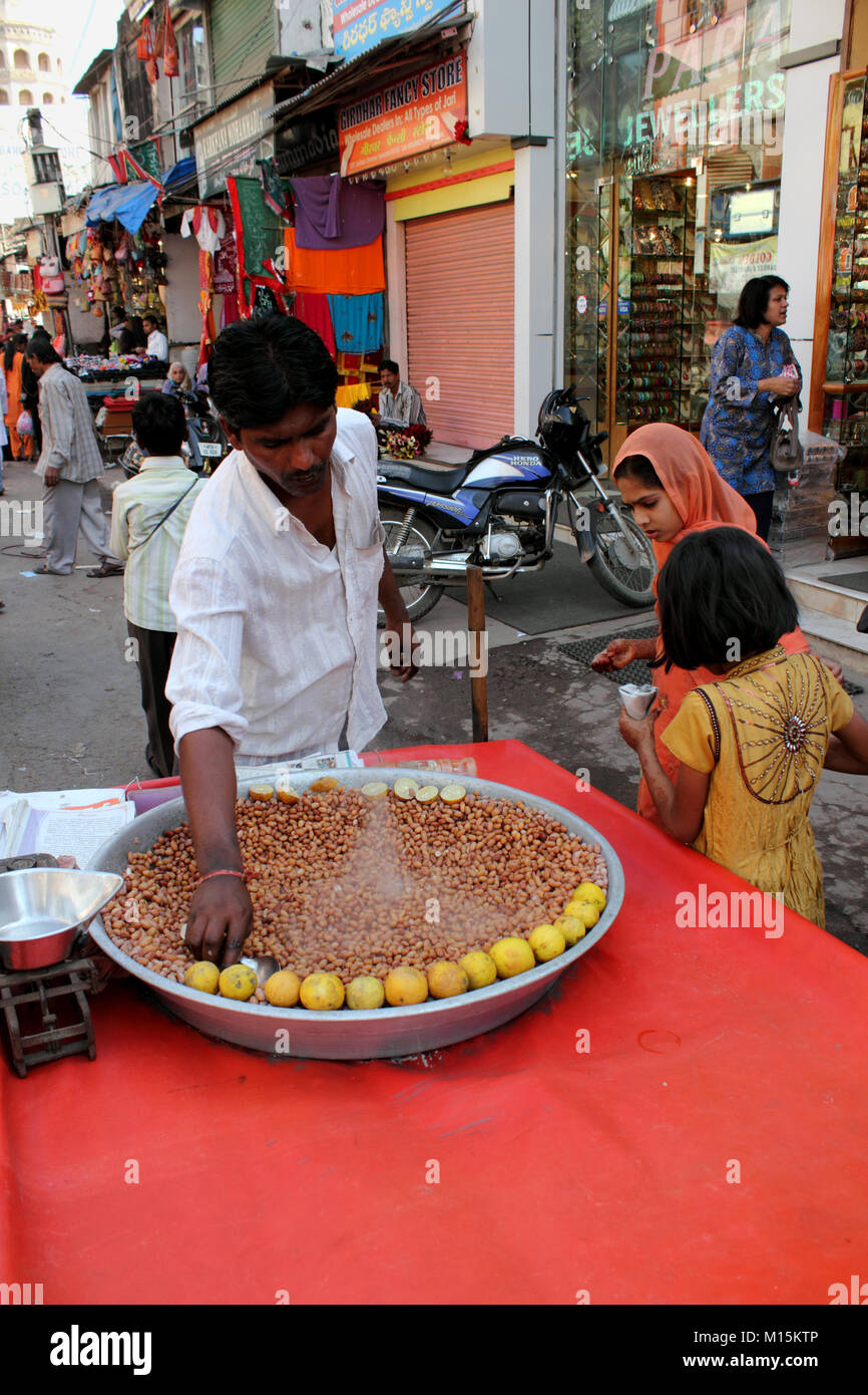 Street vendor selling peanuts to children near Charminar Hyderabad ...