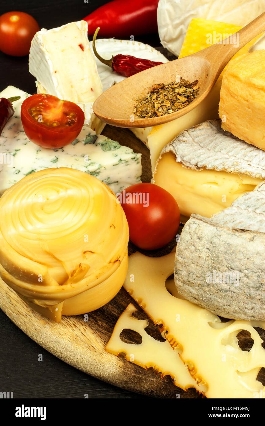 Healthy cheese. Different types of cheeses with tomato and chili pepper ...