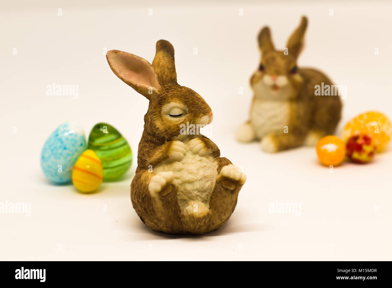 Easter bunnies with glass eggs Stock Photo - Alamy