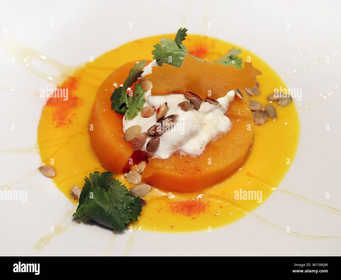 Photo of a macro pumpkin with sunflower seeds on a white plate Stock ...