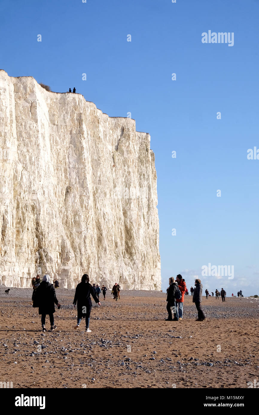Tall white chalk cliff face with a sandy pebble beach at the bottom of ...