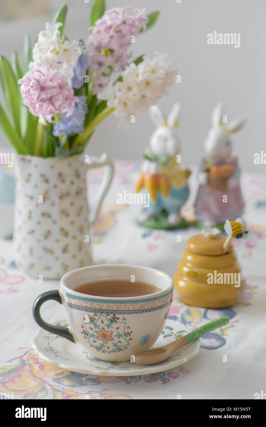 Tea for Easter with flowers and honey Stock Photo - Alamy
