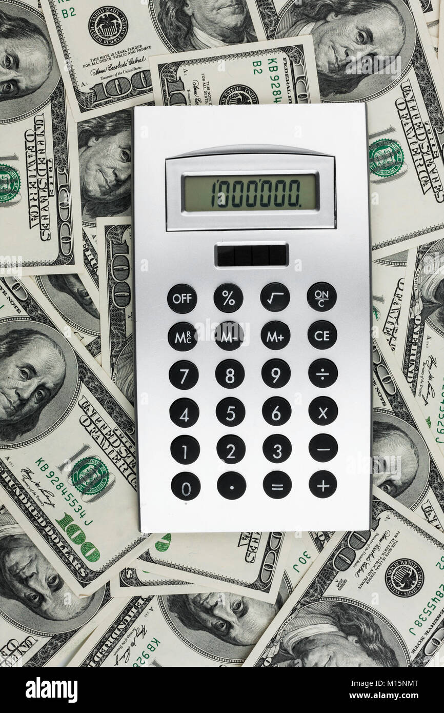 Business background. Calculator with a million on display lying on the ...