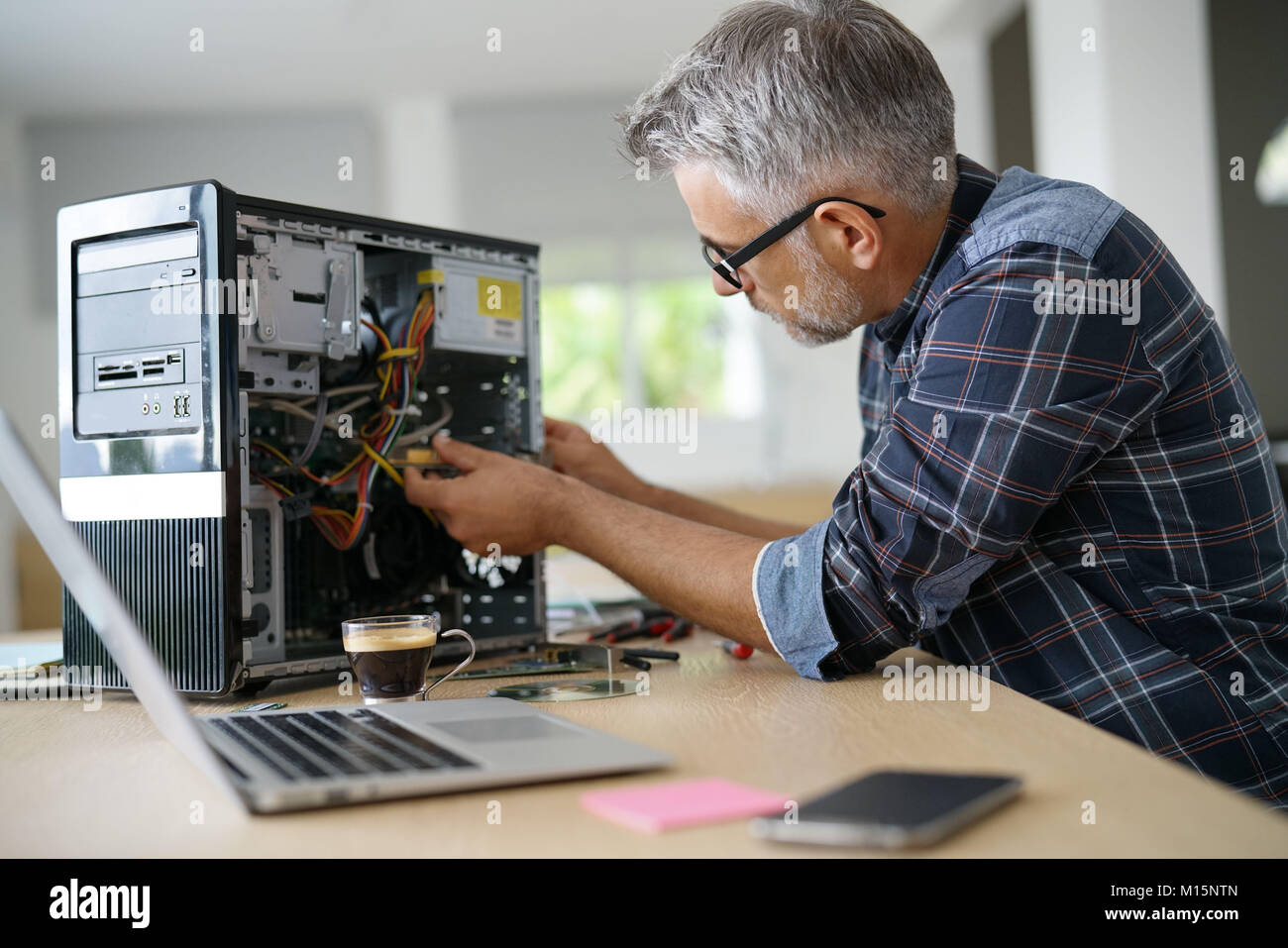 Technician repairing computer hardware Stock Photo - Alamy