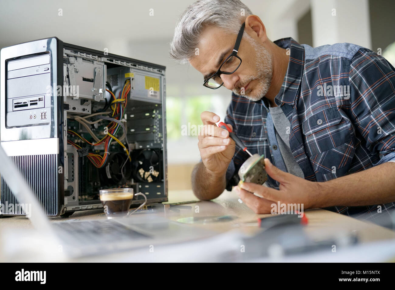 Technician repairing computer hardware Stock Photo - Alamy