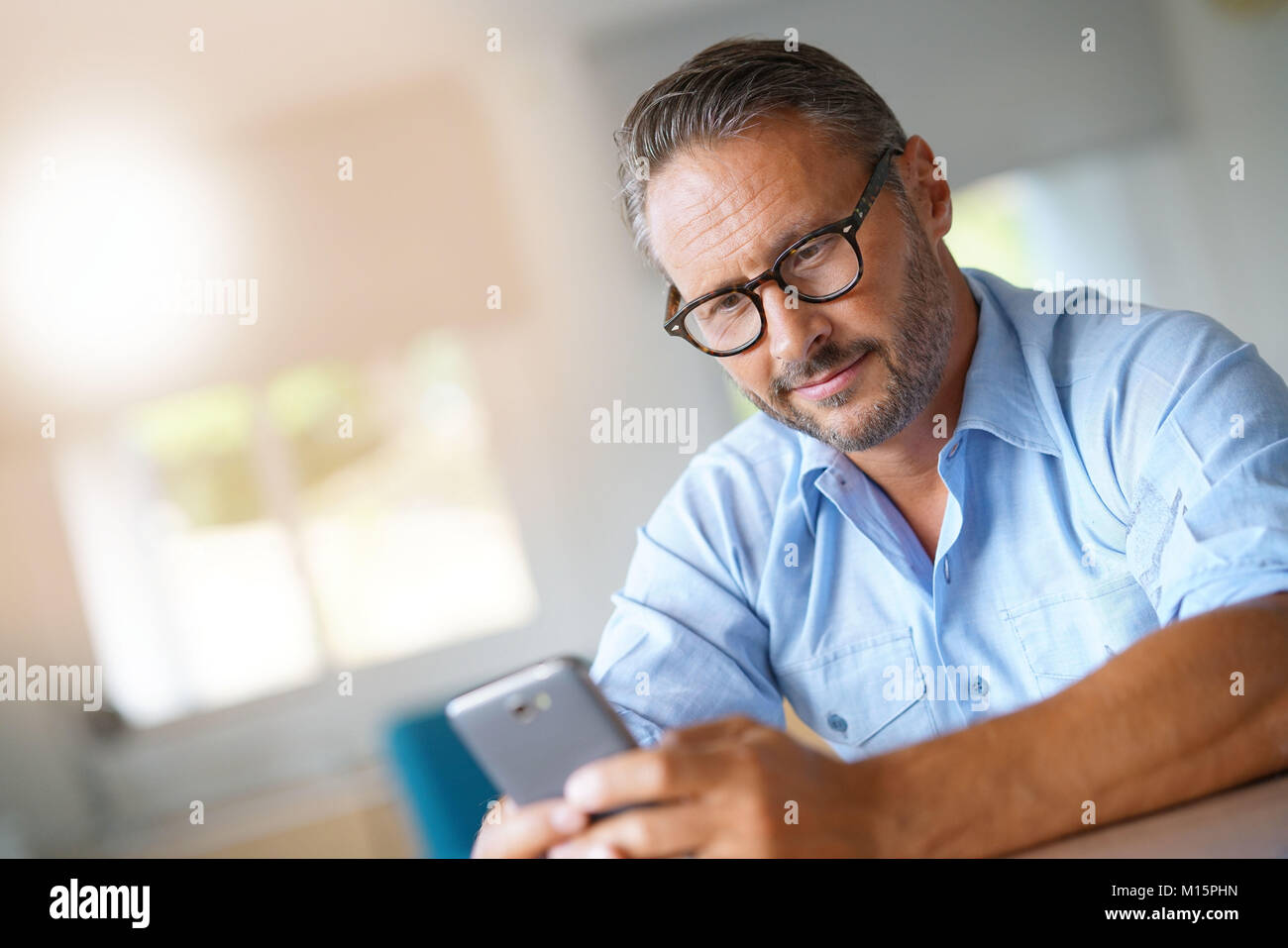 Thoughtful man typing message on hi-res stock photography and images ...