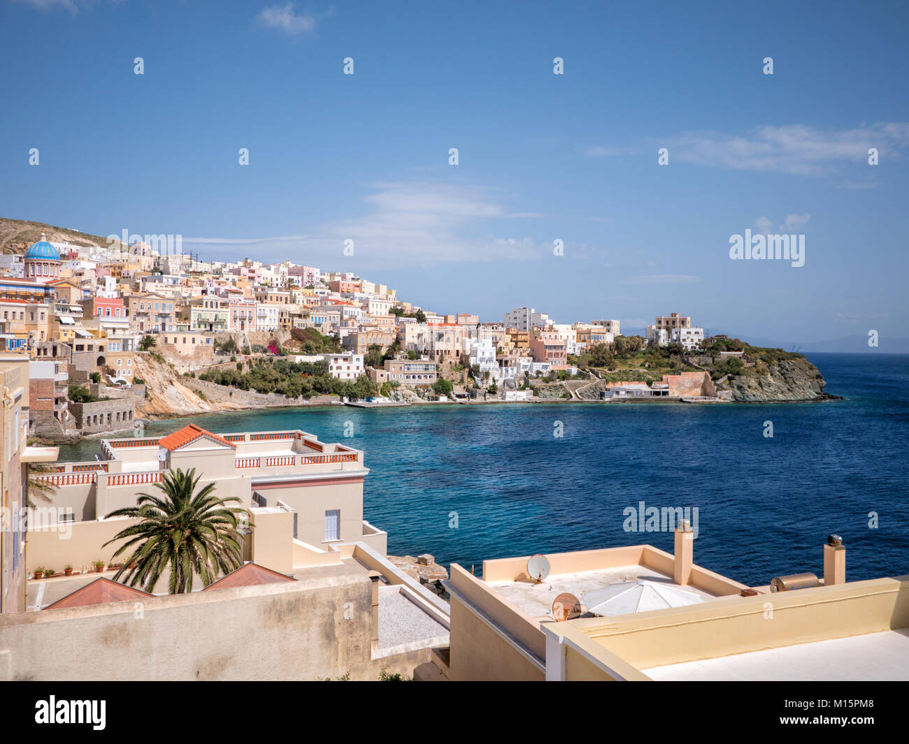 View of Syros town with beautiful buildings and houses in a sunny day ...