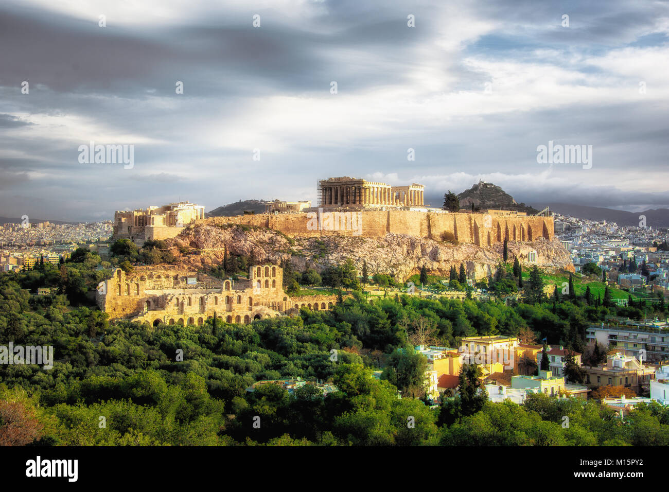 Acropolis with Parthenon. View through a frame with green plants, trees ...