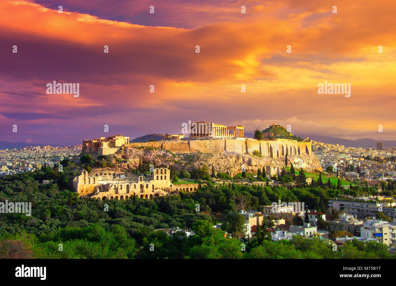 Acropolis with Parthenon. View through a frame with green plants, trees ...