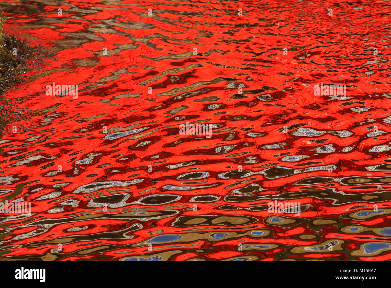 Red Reflection Ripples Stock Photo - Alamy