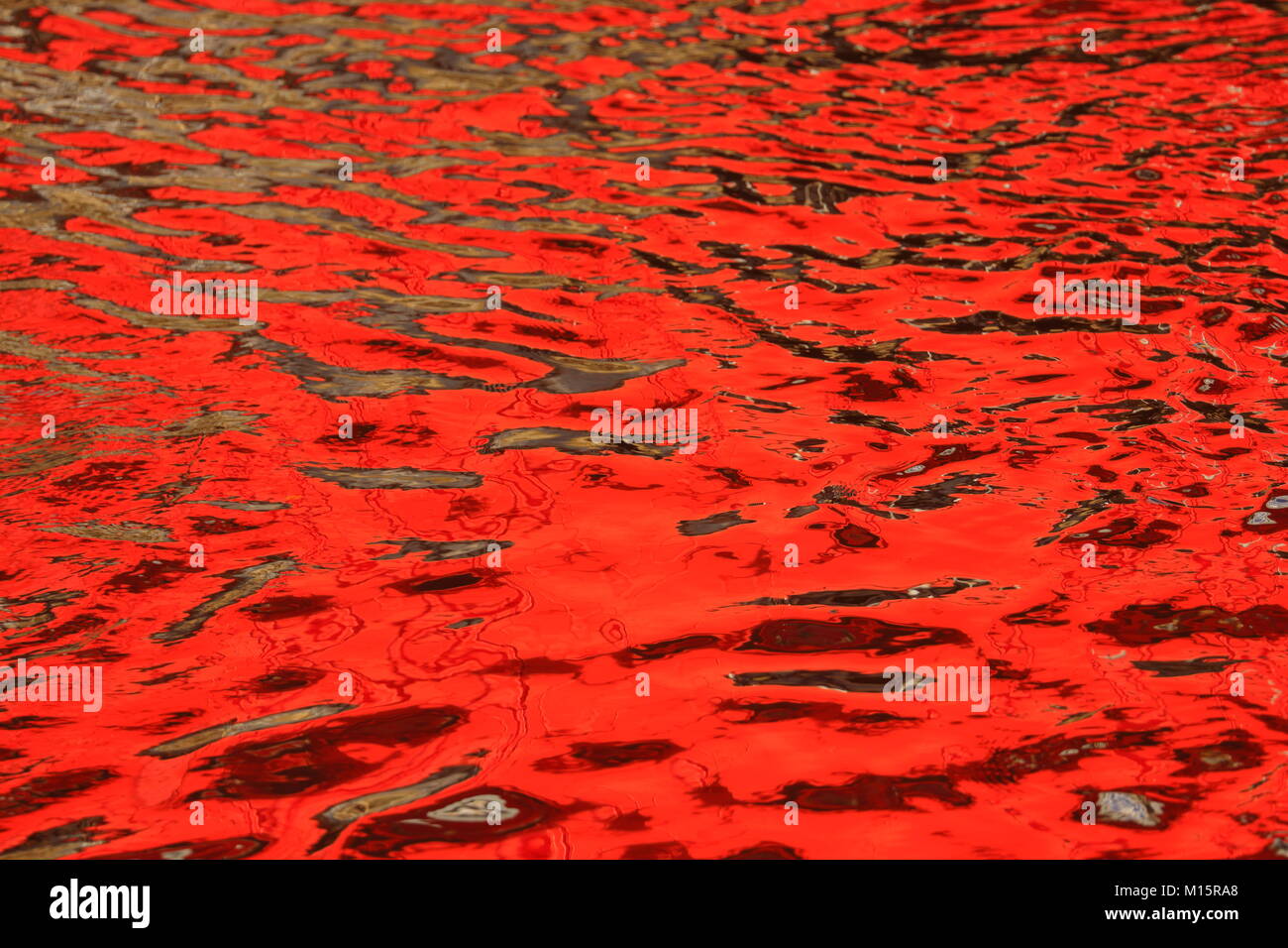 Red Reflection Ripples Stock Photo - Alamy