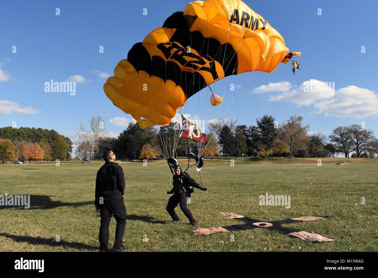Members of the U.S. Army's Golden Knights Parachute team land Nov. 22 ...