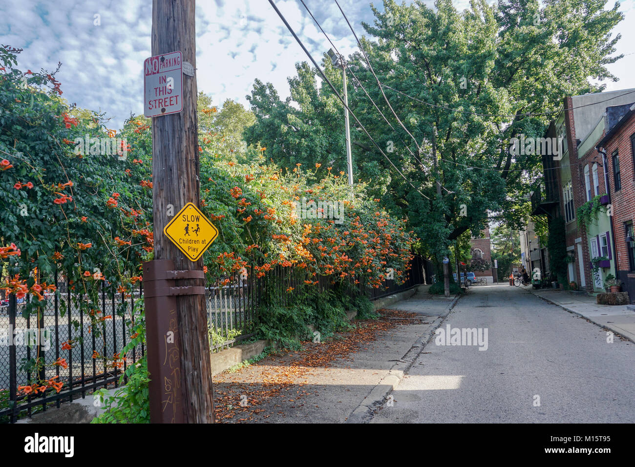 Slow, children at play signage with fall trees Stock Photo - Alamy