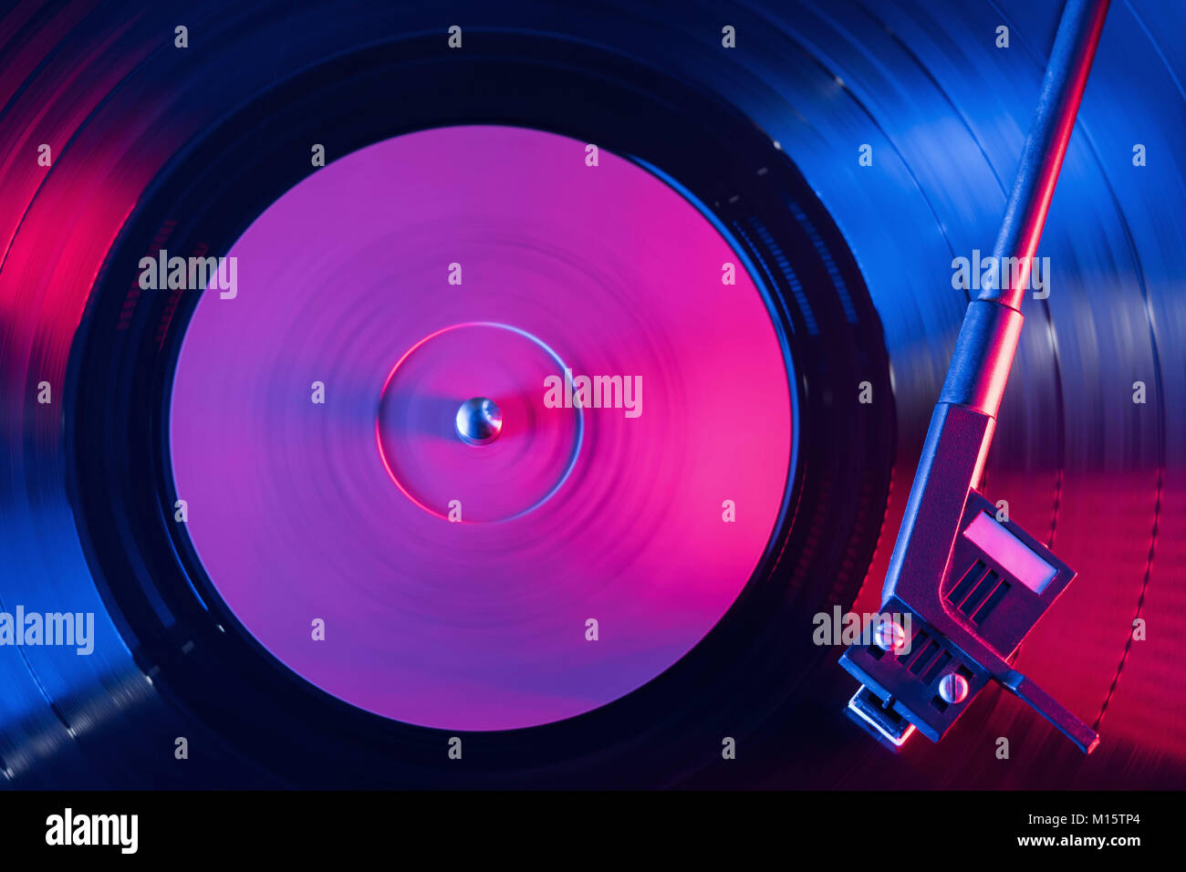 A retro-styled spinning record vinyl player. Vintage shot of old ...