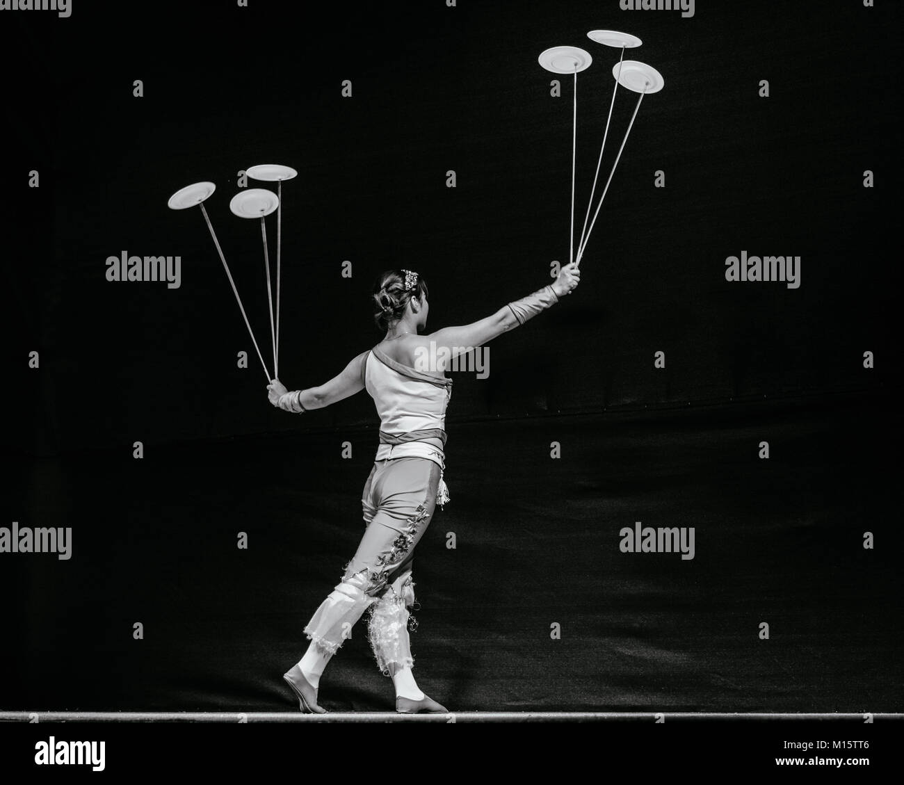 Chinese Circus Performer Spinning Plates Stock Photo - Alamy