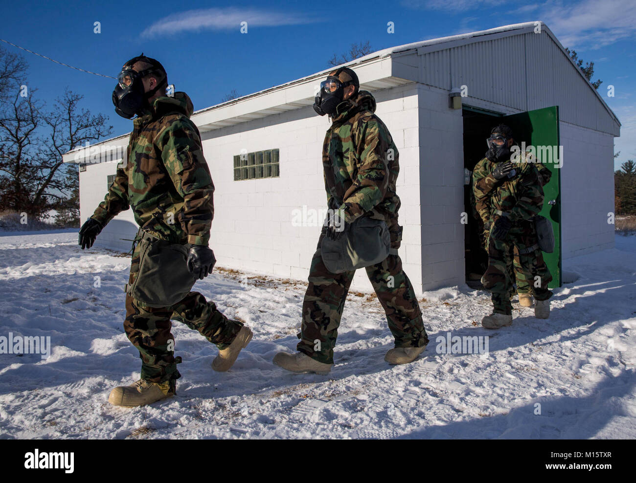 U.S. Marines with Marine Air Control Group 28 exit a gas chamber during ...