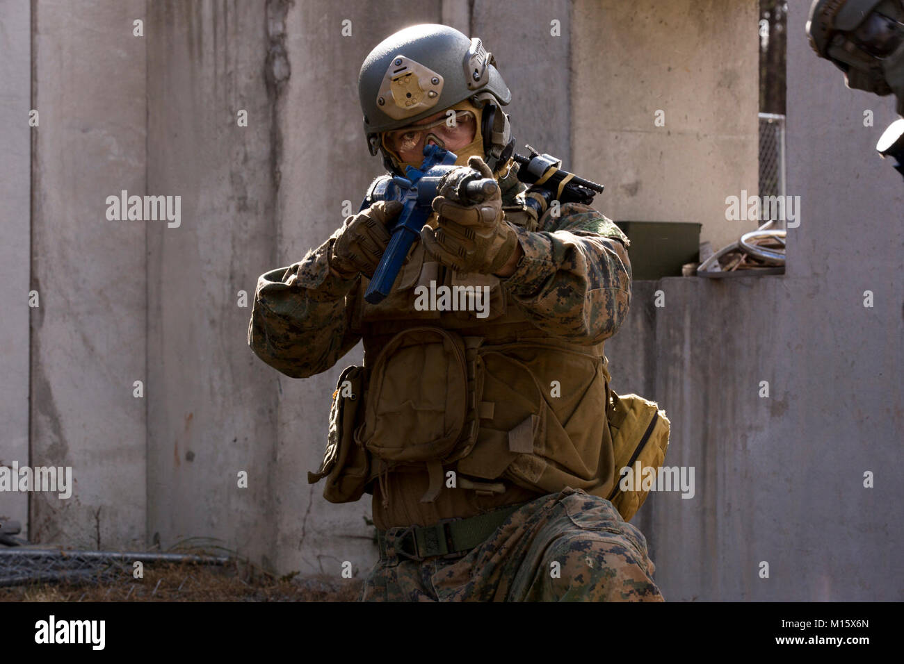 A U.S. Marine attending the Methods of Entry (MOE) provides security ...