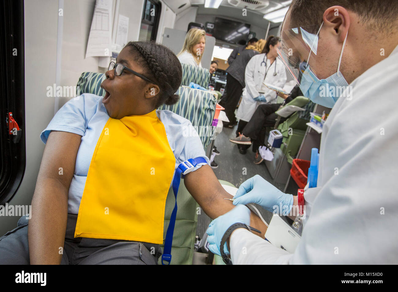 Phlebotomist Kevin Clark, right, Miller Keystone Blood Center, Ewing, N ...