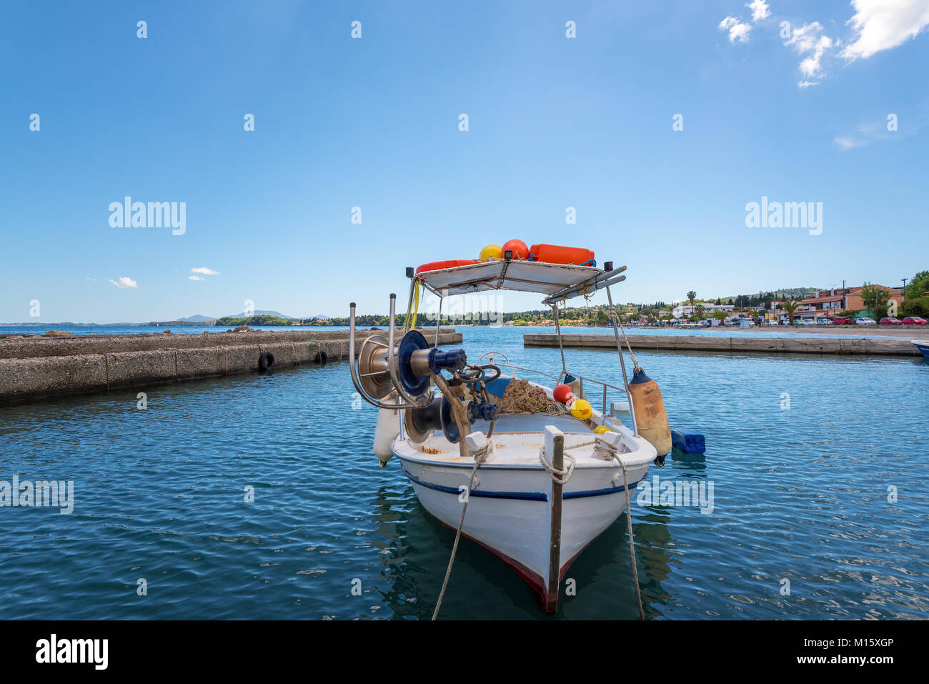 Fishing boat anchoring in port of Ipsos on Corfu island. Greece Stock ...