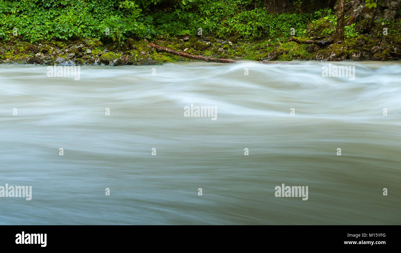 A river in the alps after heavy rainfall in summer Stock Photo - Alamy