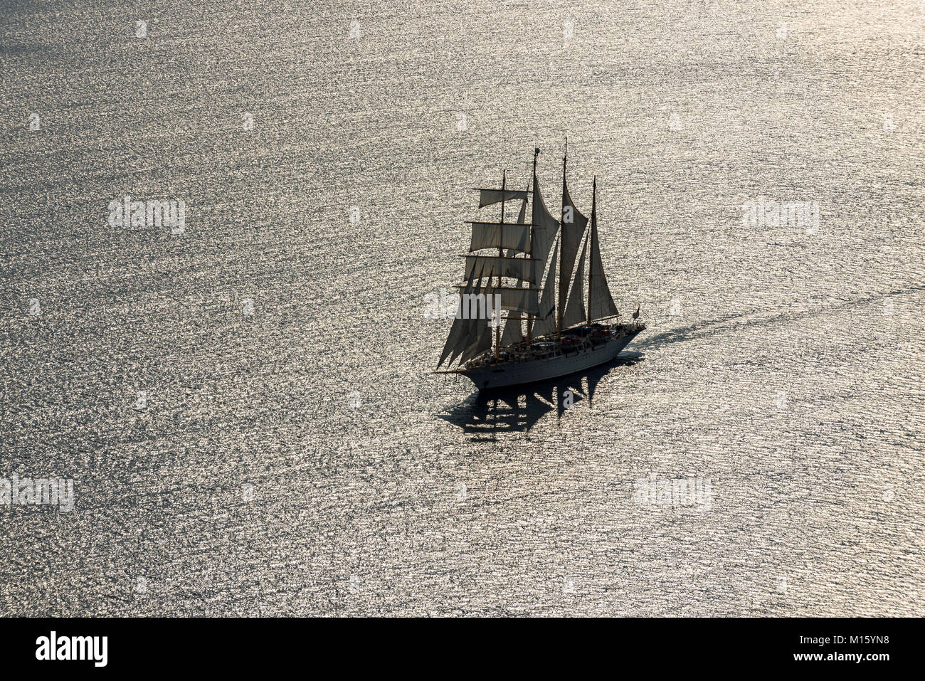 Sailing ship in the back light at Santorini,Santorini,Greece Stock ...